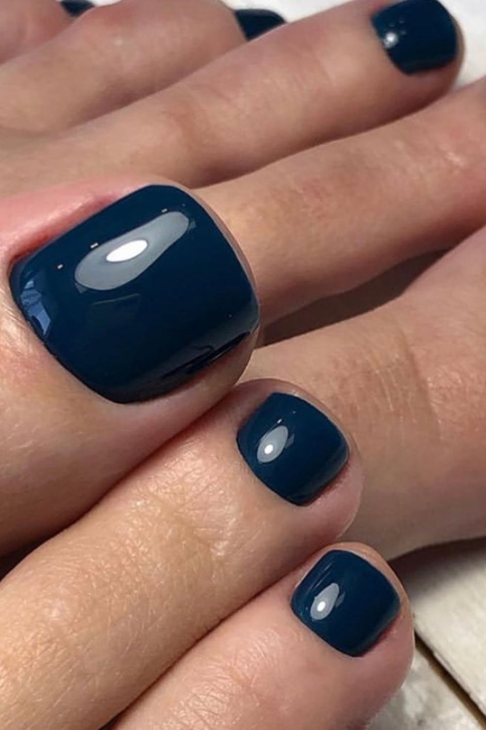 22 Chic & Bold Dark Toe Nail Colors to Try This Season